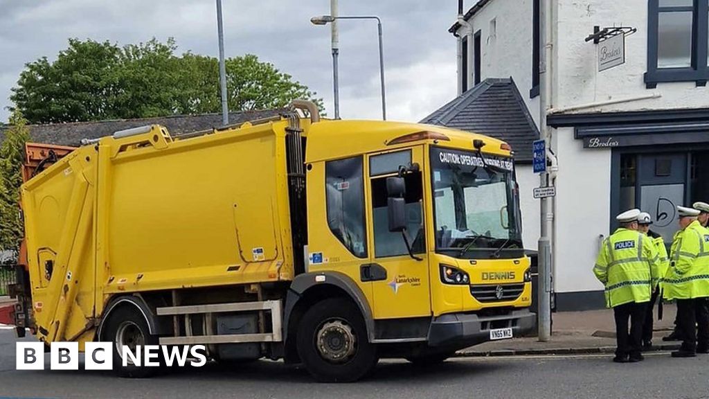 Man seriously injured after being hit by bin lorry - BBC News