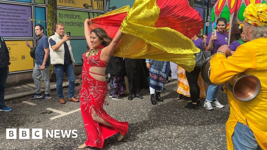 Mela parade brings colour to Belfast city centre - BBC News