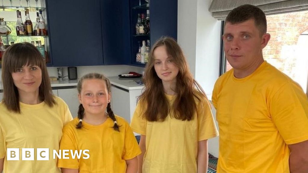 Ukraine family get their own home after sharing for months - BBC News