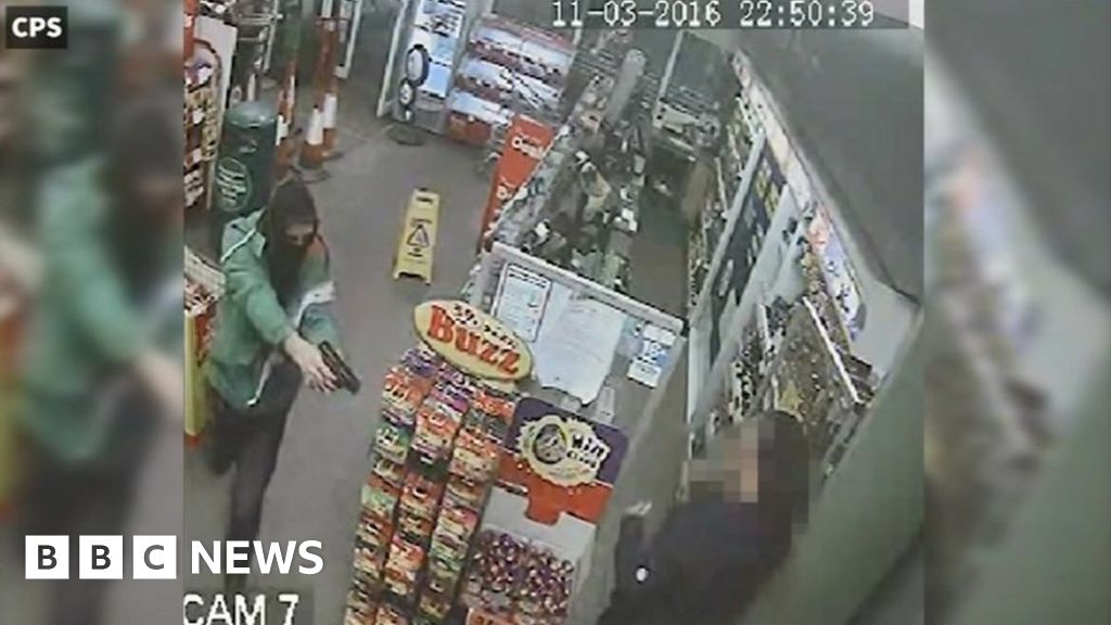 Moment masked robber sprayed shop worker with petrol on CCTV