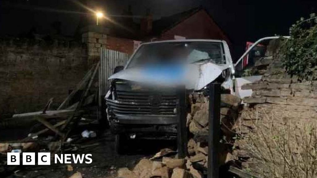 Nottingham: Robbers attacked milkman and crashed float into wall - BBC News