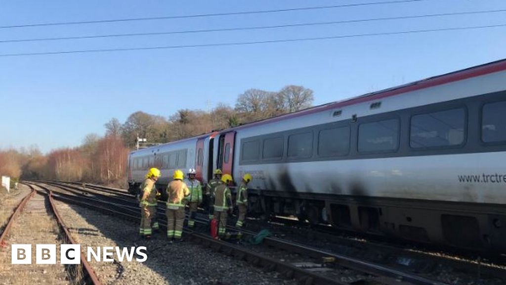 Eighty evacuated over train fire reports - BBC News