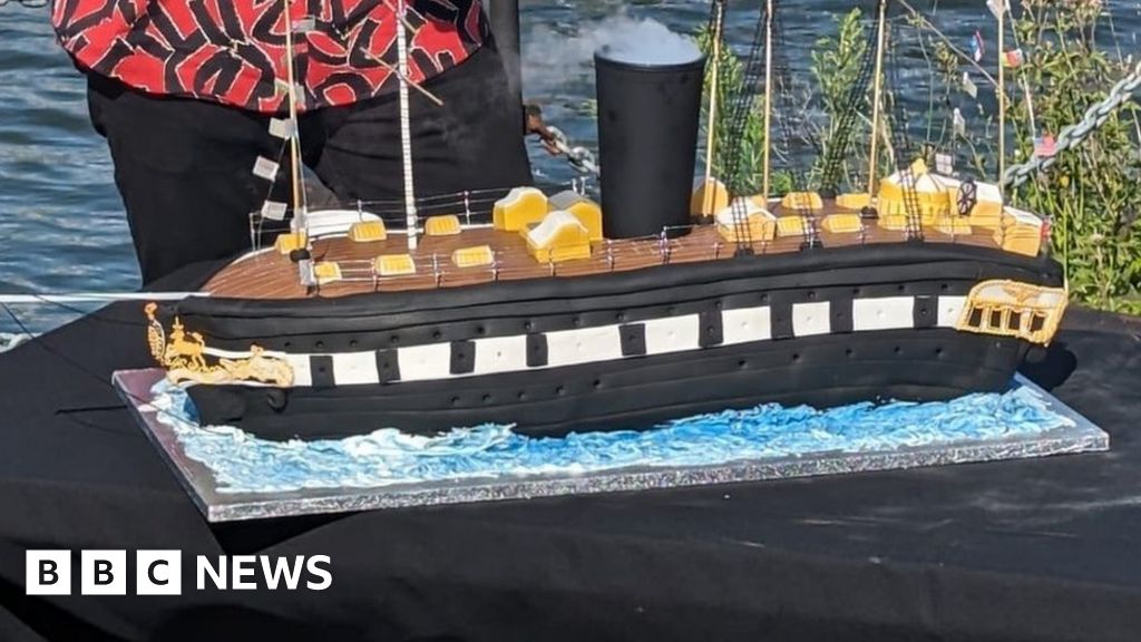 Bake Off star unveils special cake for ship anniversary - BBC News
