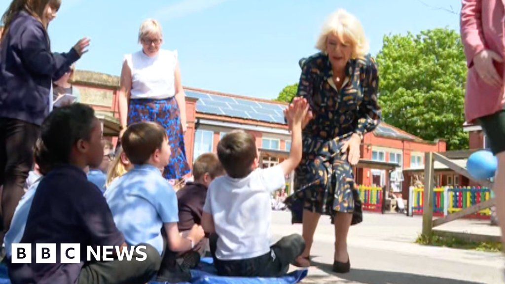 Queen Camilla gives Bristol boy high five in first solo outing