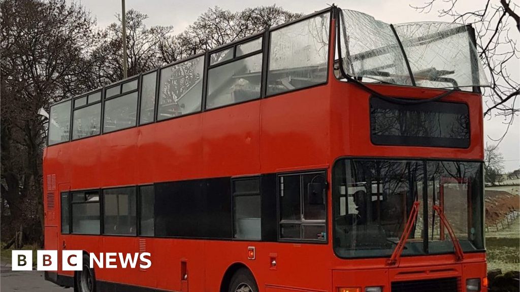 Skipton school bus roof ripped off in bridge crash - BBC News