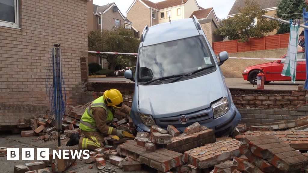 Jersey driver crashes into wall while attempting to park - BBC News