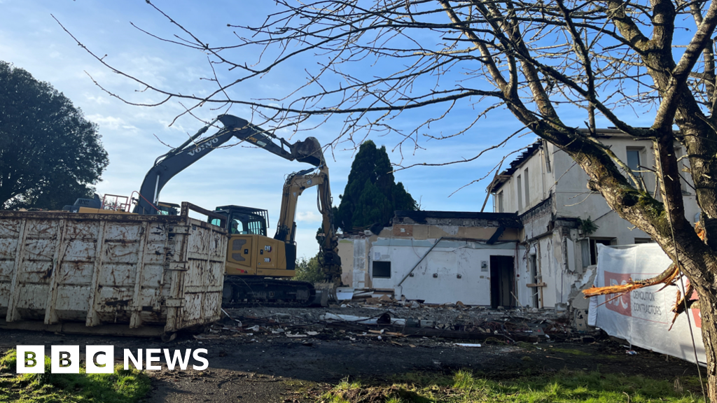 Demolition of unused buildings begins at new hospital site - BBC News