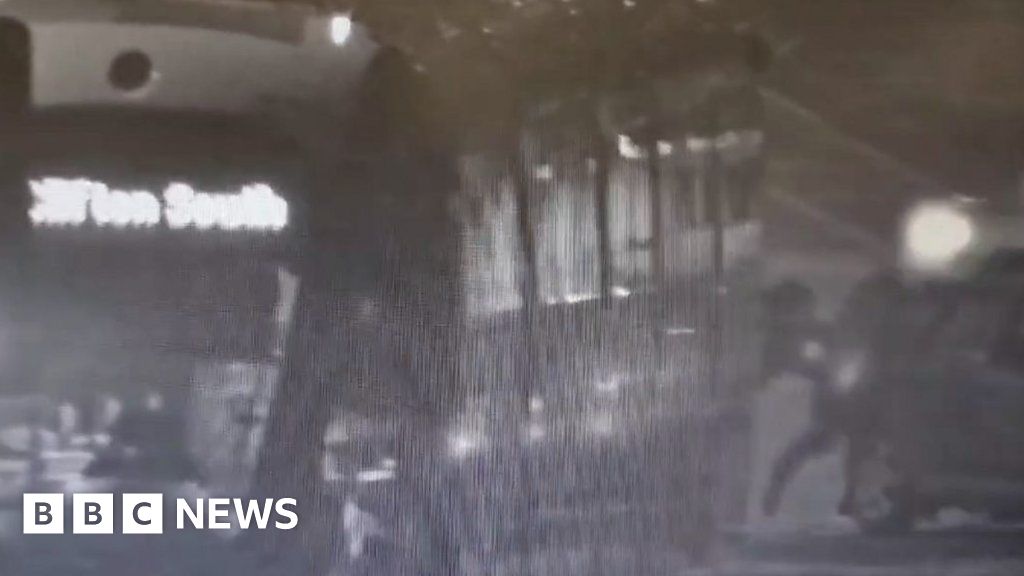 Nottingham tram 'legends' help push car from tracks - BBC News