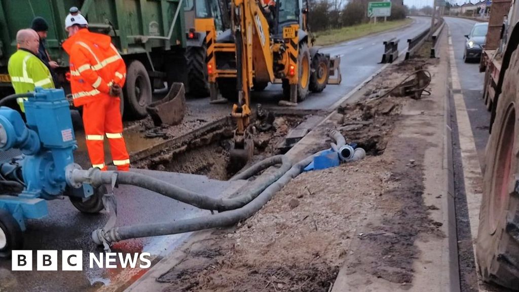 A38 Staffordshire closed after water main bursts - BBC News
