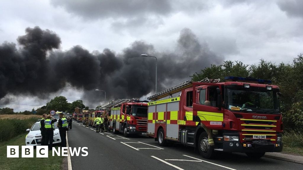 Homes evacuated after fire leads to explosions - BBC News
