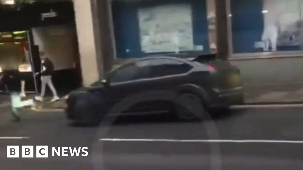 Newcastle car attack: Footage shows man knocked to ground - BBC News