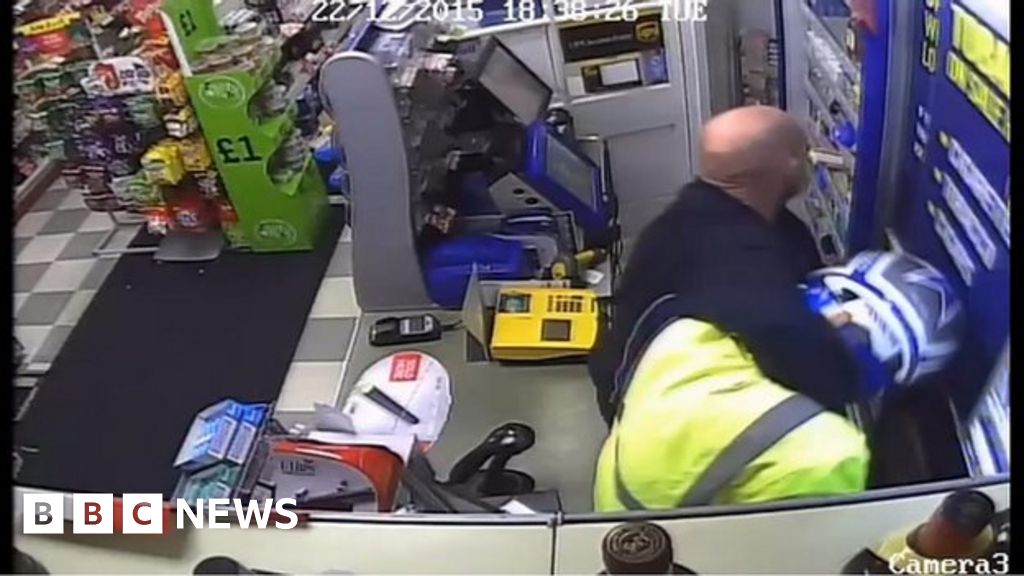 'Hero' Customer tackles gunman on CCTV in Norwich shop - BBC News