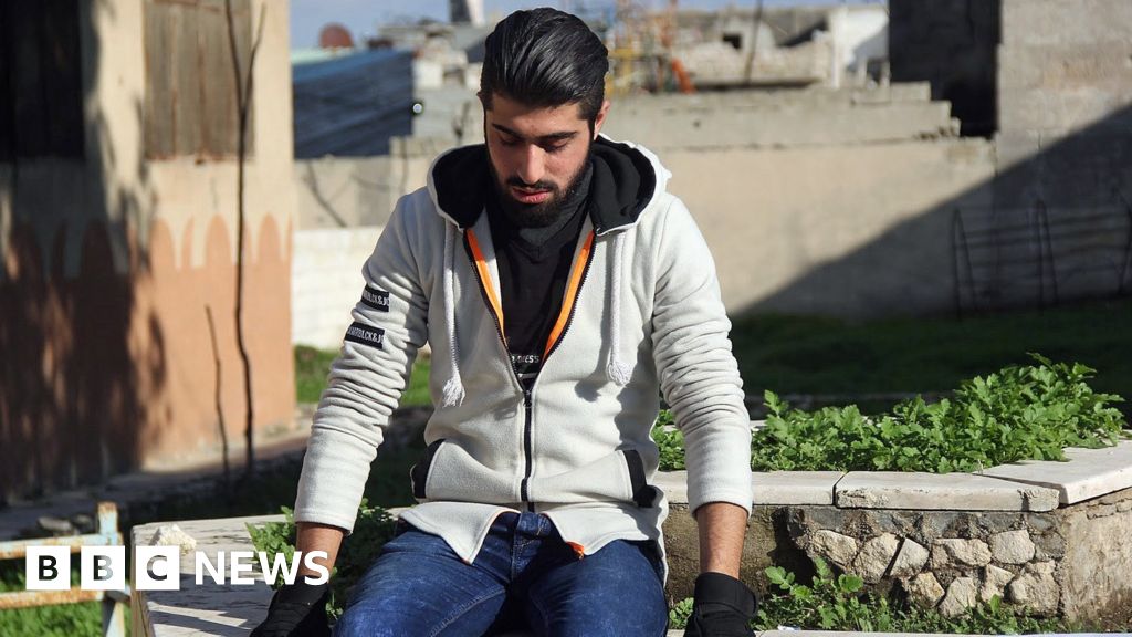 Syrian rapper battles on all fronts in war-torn Idlib - BBC News