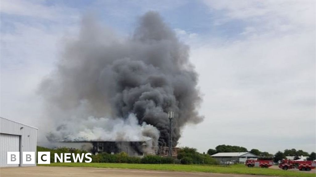Hangar on fire by Southend Airport runway - BBC News
