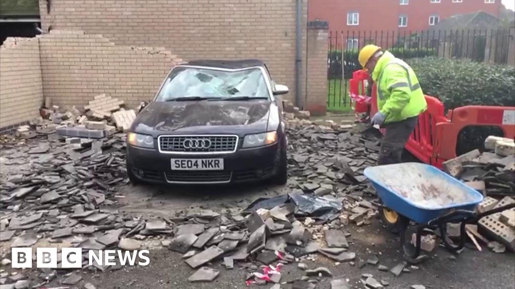Car crushed after bin lorry hits car port in Colchester - BBC News