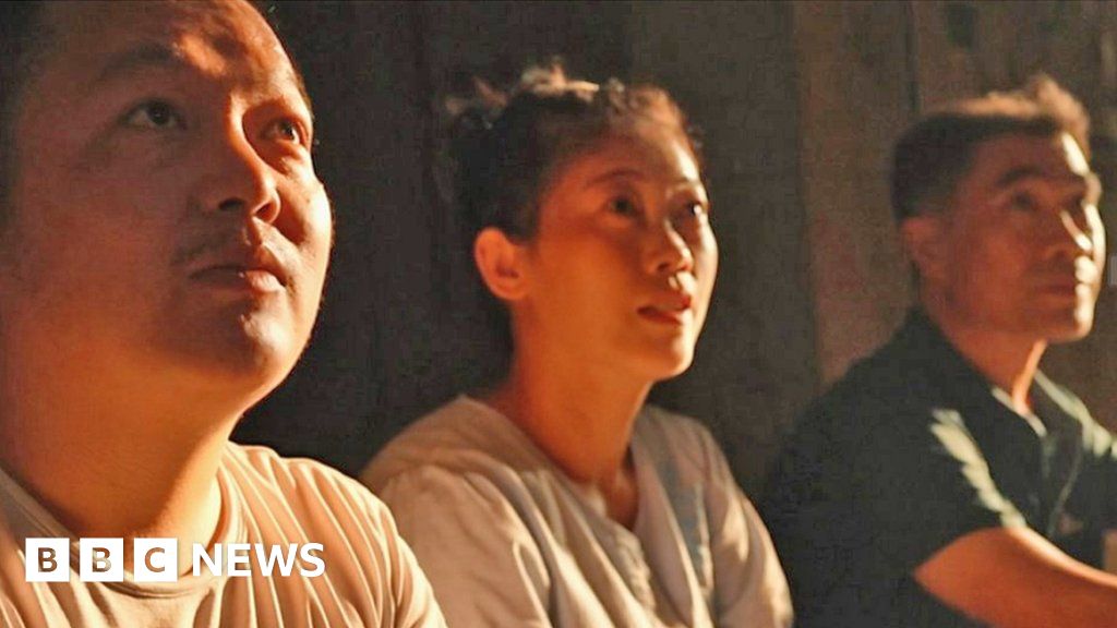 China housing crisis: The people living in unfinished apartments - BBC News