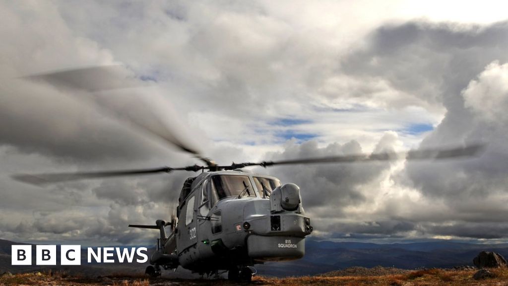 Navy bids farewell to Lynx helicopter with flypast - BBC News
