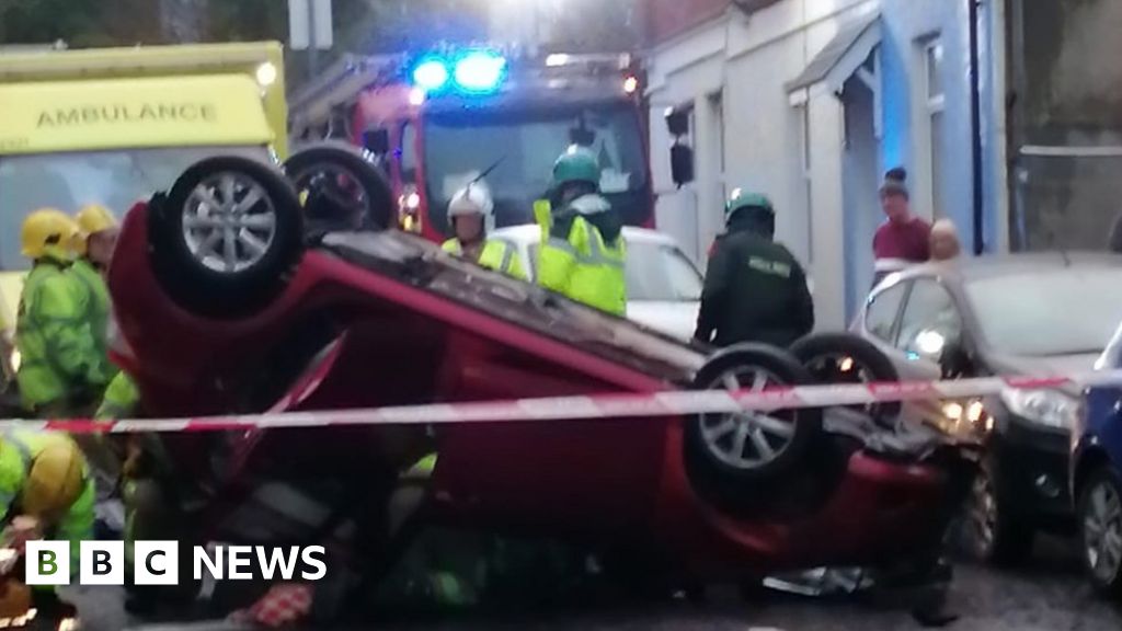 Woman cut from car after four-vehicle crash - BBC News