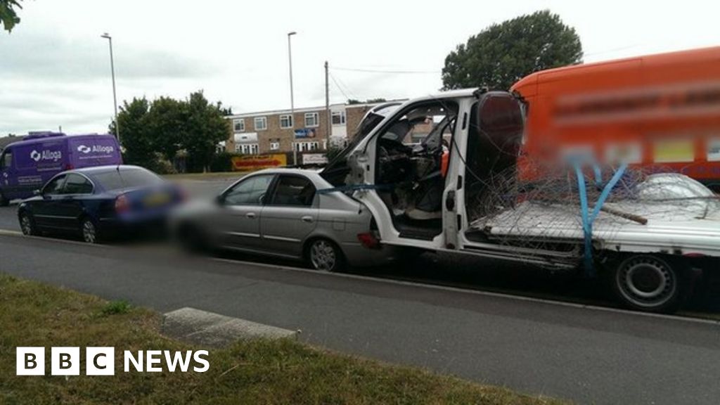 Gloucester driver caught towing van-strapped-in-car-boot - BBC News