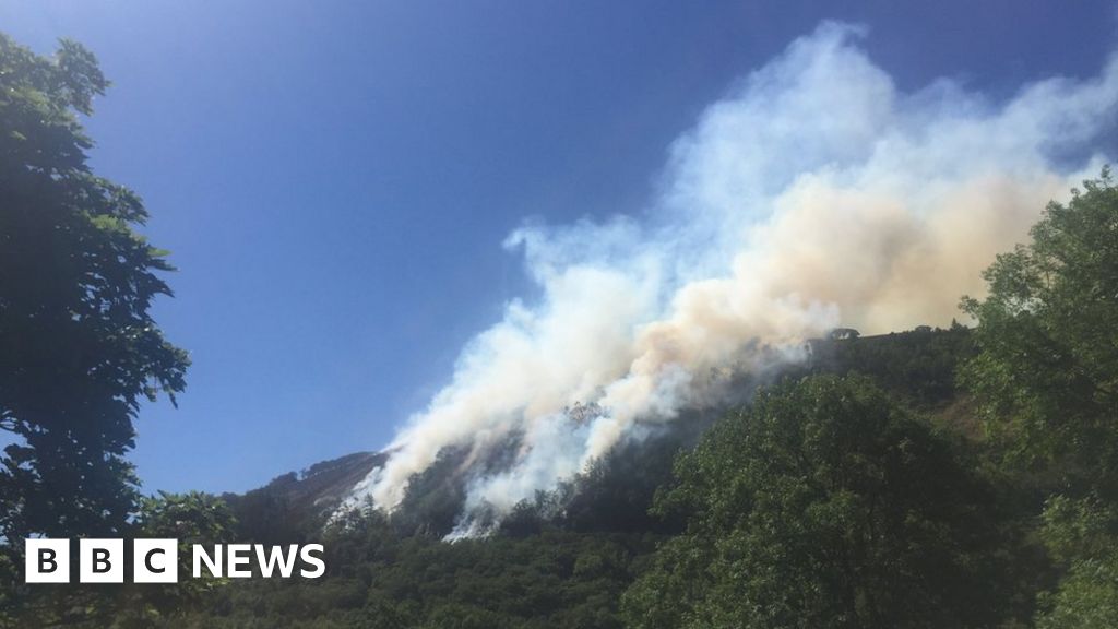 Wildfire smoulders in Aberystwyth after burning for three days - BBC News