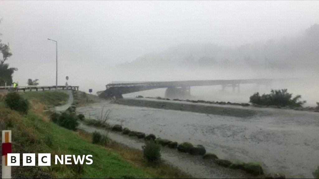New Zealand bridge washed away in heavy storm - BBC News
