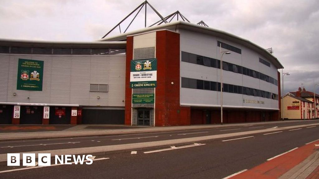 Wrexham FC Supporters Trust sign 99-year stadium lease - BBC News