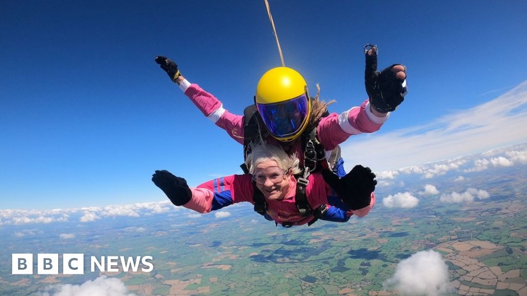 Stone woman with fear of heights does charity skydive - BBC News
