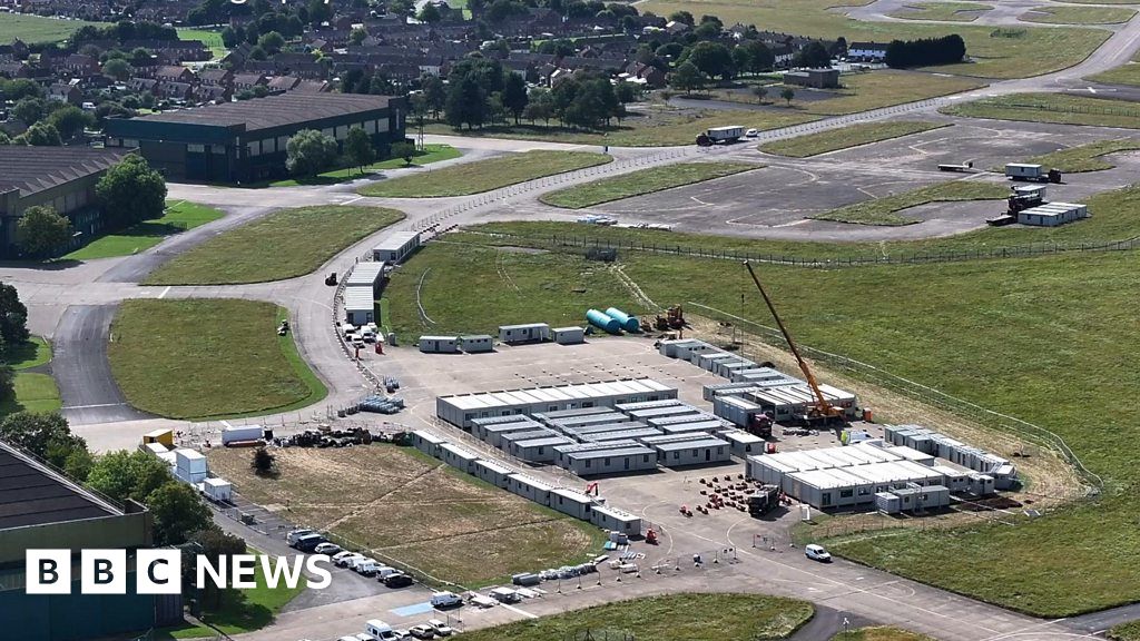 RAF Scampton: Drone footage shows extent of asylum centre work - BBC News