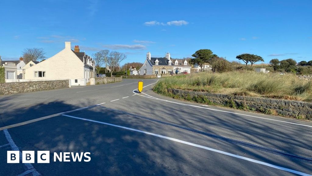 Pedestrian walkway and bollard installed on coastal road - BBC News