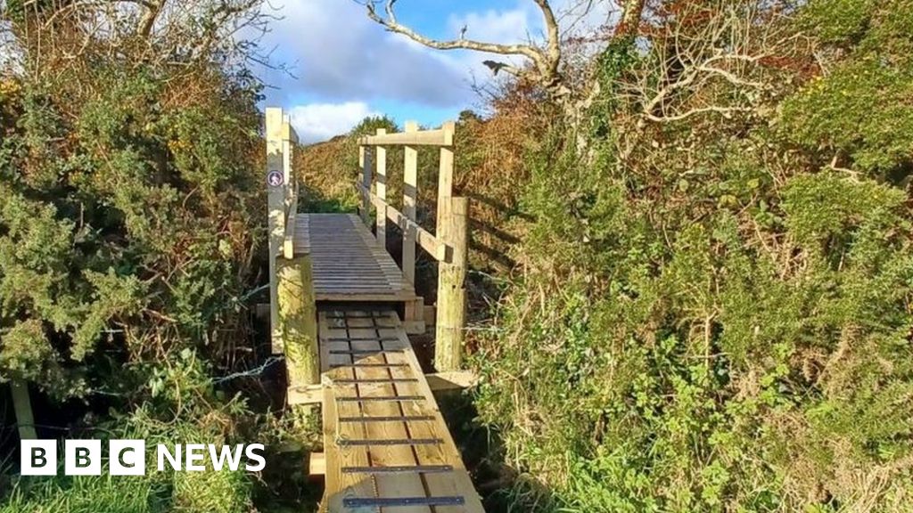 Manx footpath reopens after extensive repairs to wooden furniture - BBC ...