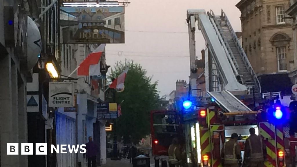 Gloucester New Inn Grade I listed hotel damaged by fire - BBC News