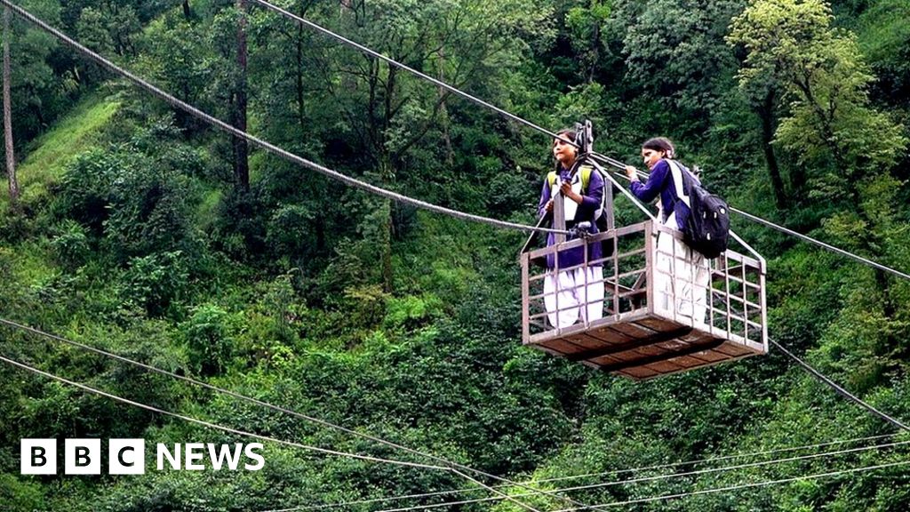 Two sisters, a mountain trek and a wobbly wire bridge - BBC News