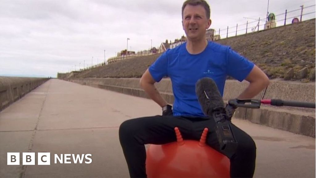 Man bounces from Fleetwood to Lytham in space hopper challenge - BBC News