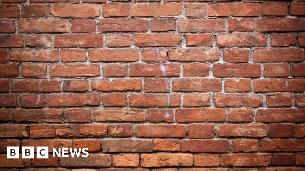 Man's front door bricked up as he sleeps - BBC News