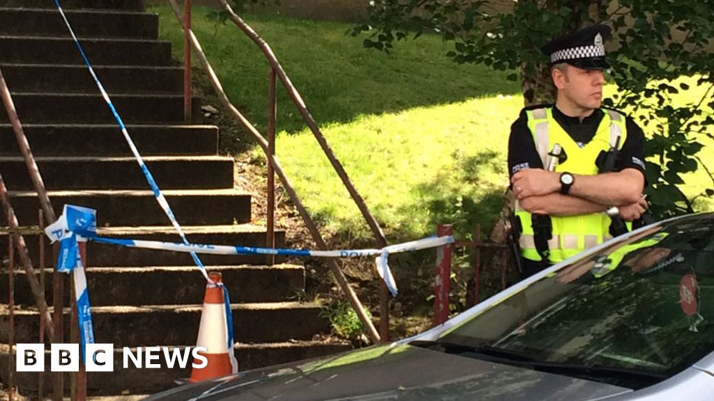 Man's death 'unexplained' after body found in flat - BBC News