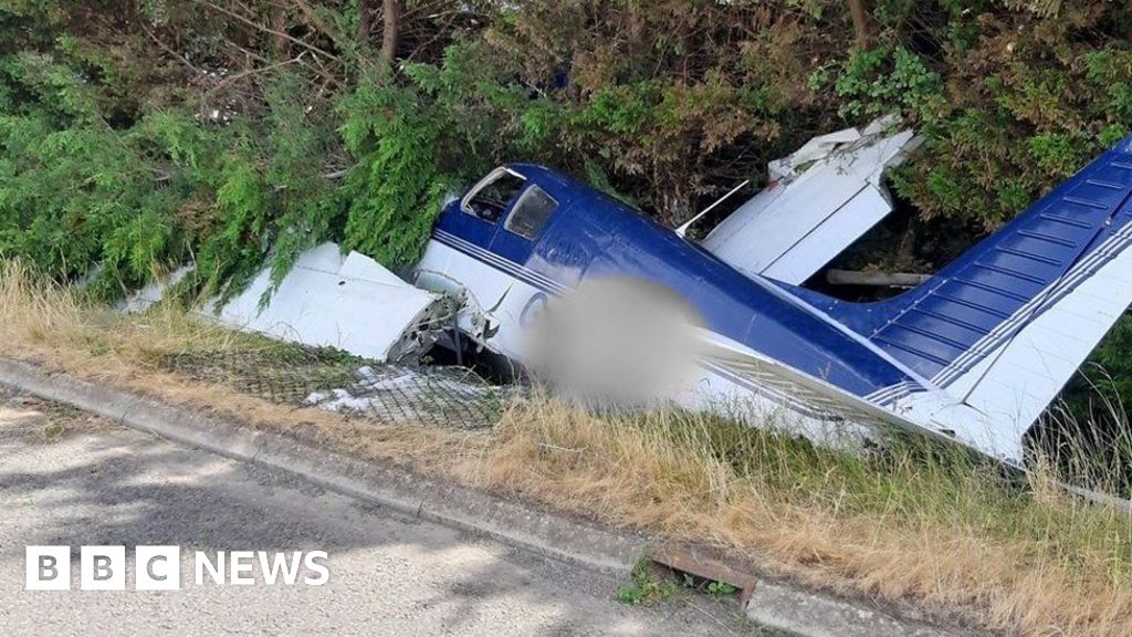 CCTV shows light aircraft narrowly avoiding hitting larger jets