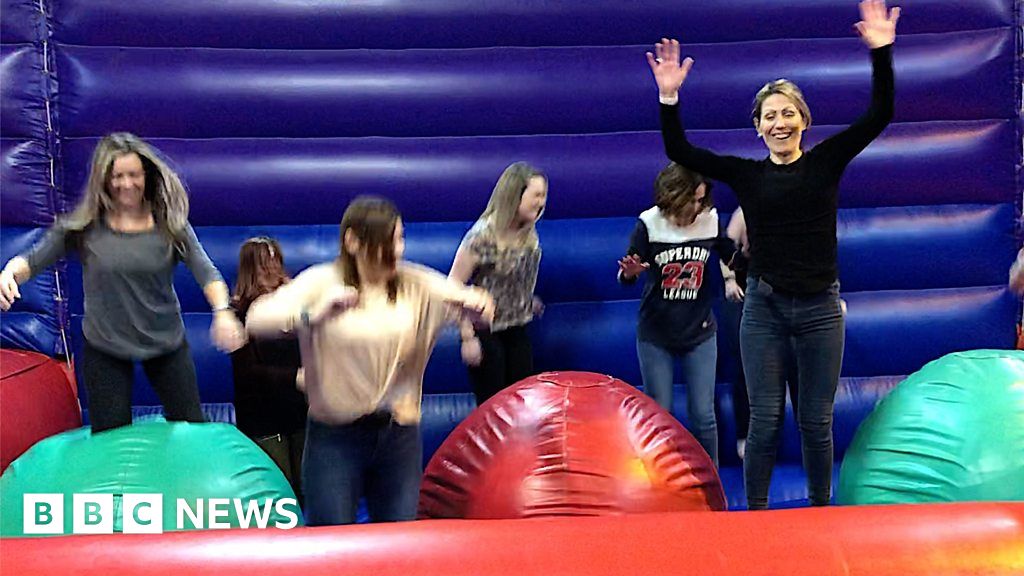 Adults-only inflatables night in Ipswich rekindles childhood joy - BBC News