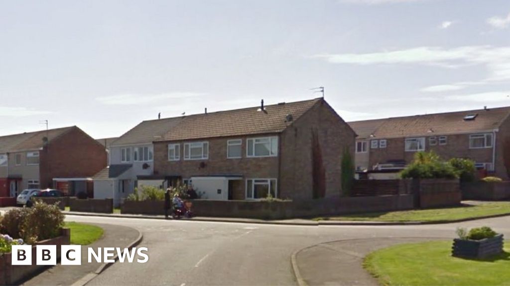 Holyhead man released after woman's body found at flat - BBC News