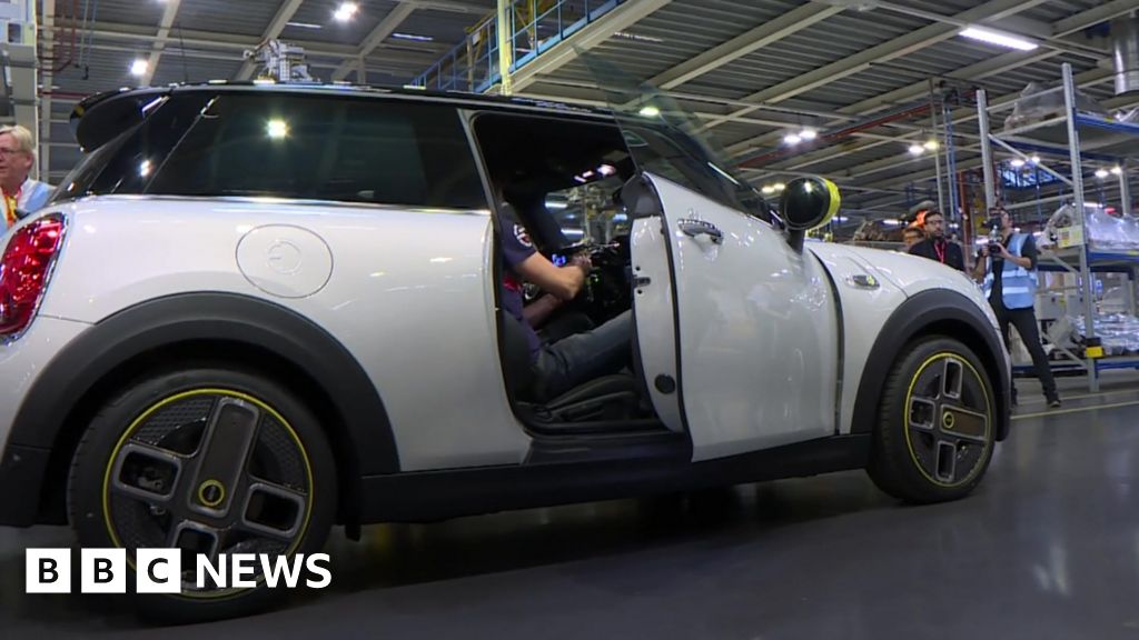 Mini launches its first all-electric car - BBC News