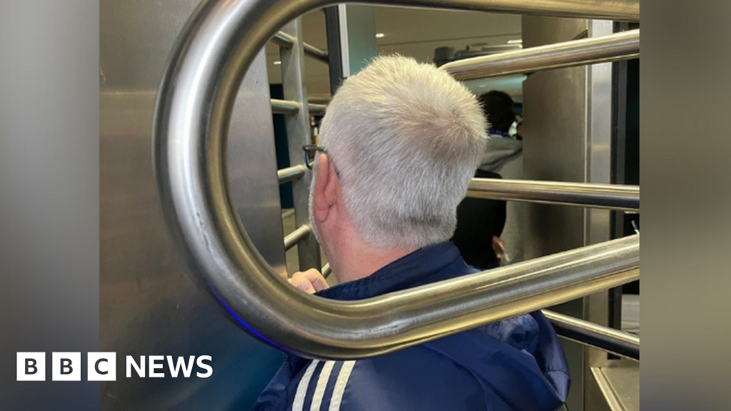 Peterborough fan trapped in Wembley turnstile photo goes viral - BBC News