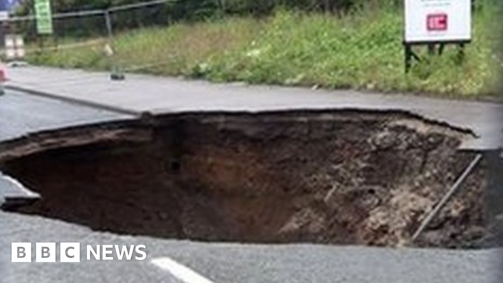 Huge Sinkhole Closes Manchester Road Bbc News