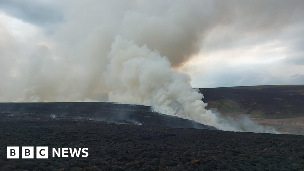 Marsden Moor wildfire under control as crews remain at scene - BBC News