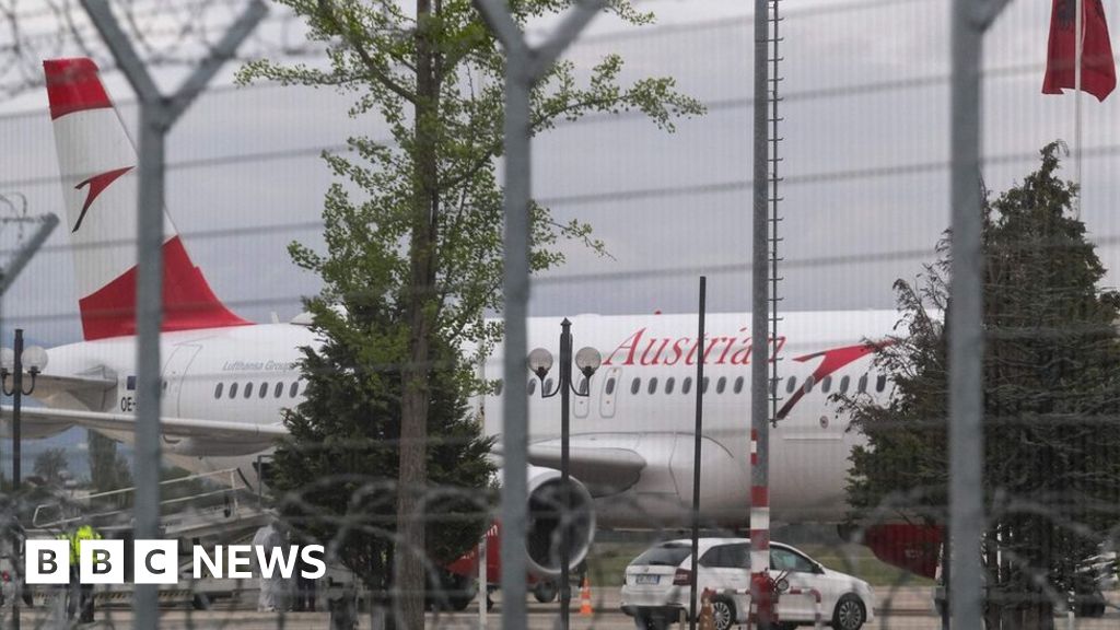 Albania manhunt after gang target plane in '€10m heist' - BBC News