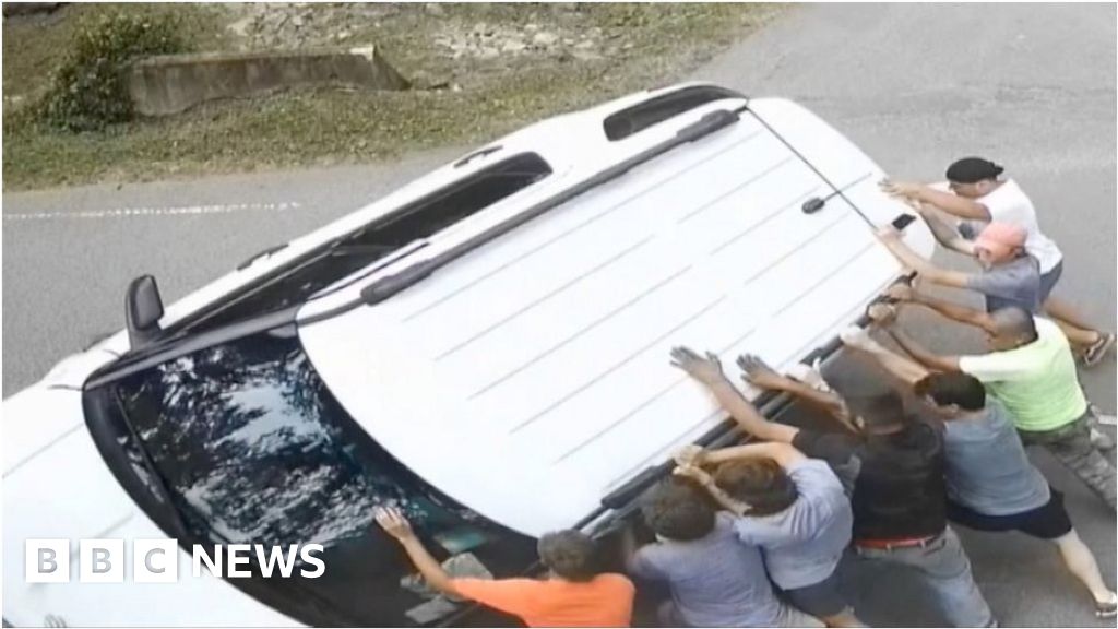 Flipped car turned over by good Samaritans