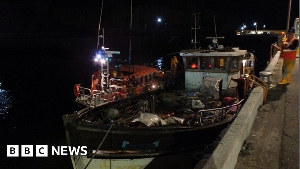 Four rescued after fishing boat starts taking on water - BBC News