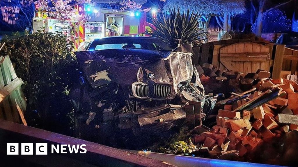 Garden destroyed as BMW smashes into Woodhurst wall