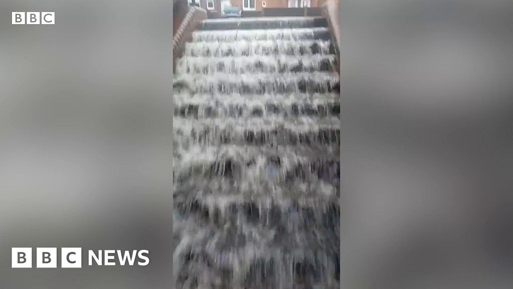 Storm turns flight of steps in Telford into waterfall - BBC News
