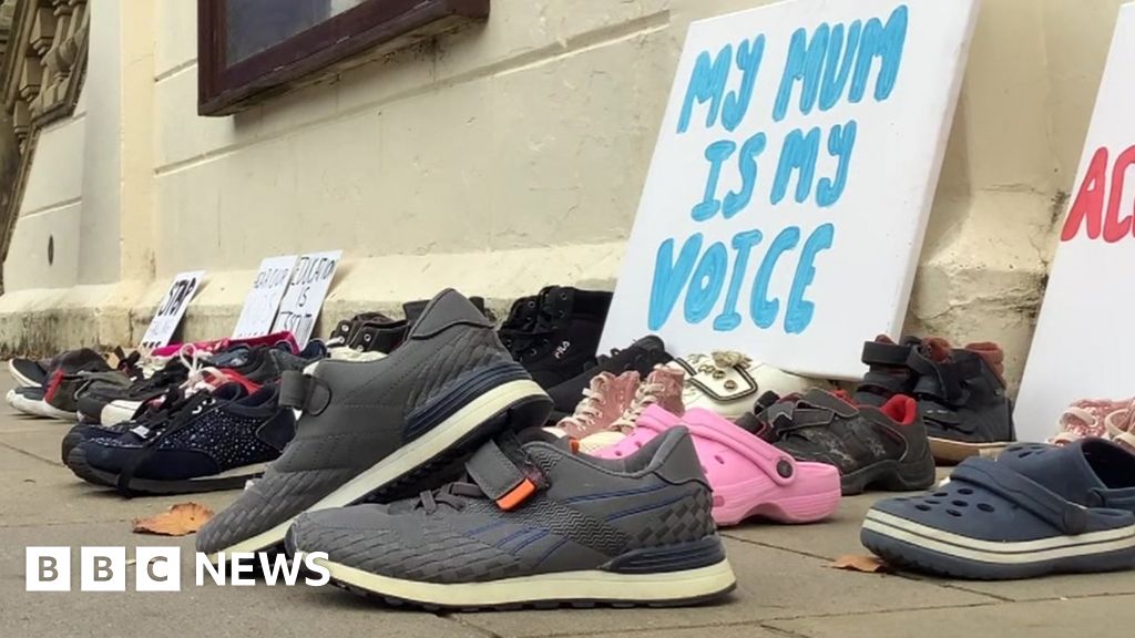 Parents use children's shoes in Merseyside council protest