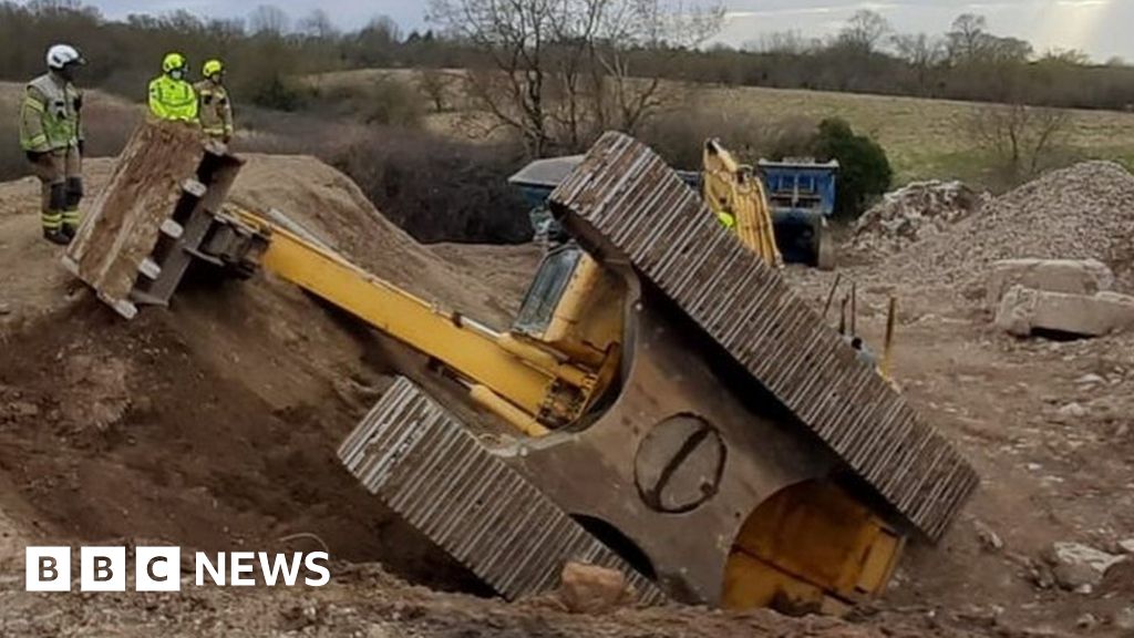 Man rescued after digger overturns on Harlow site - BBC News