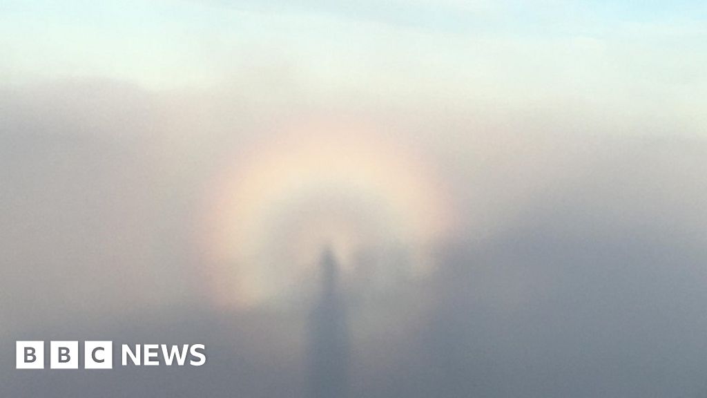 Snowdon walker captures rare Brocken spectre - BBC News